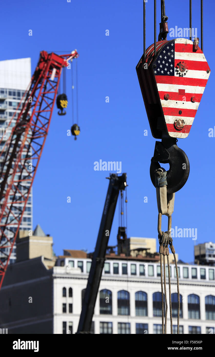 American flag painted on main hook block of a construction crane on ...