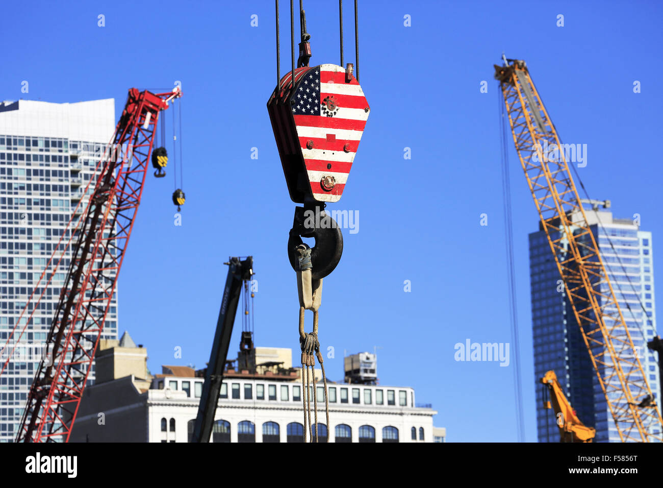 American flag painted on main hook block of a construction crane on ...