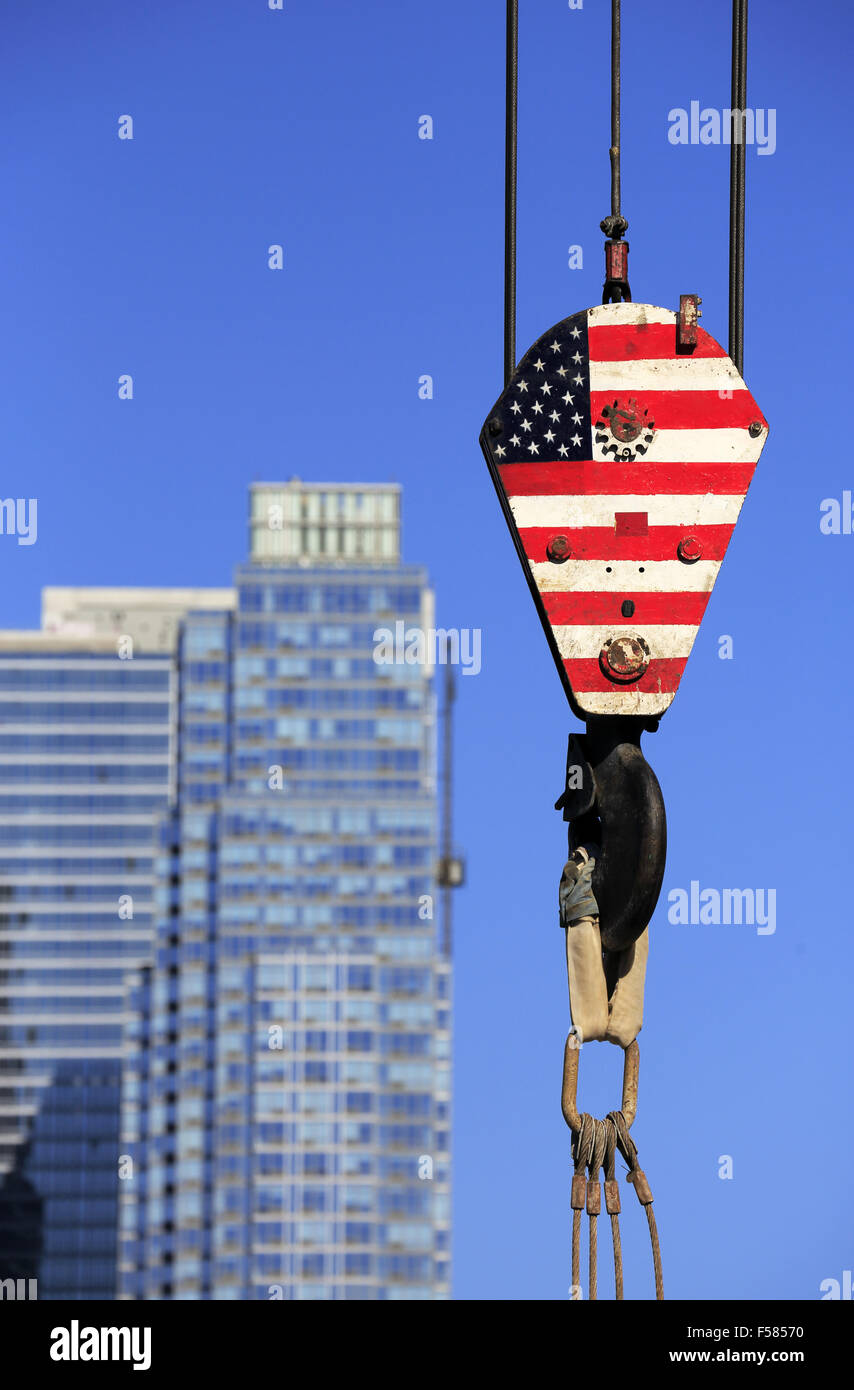 American flag painted on main hook block of a construction crane on ...