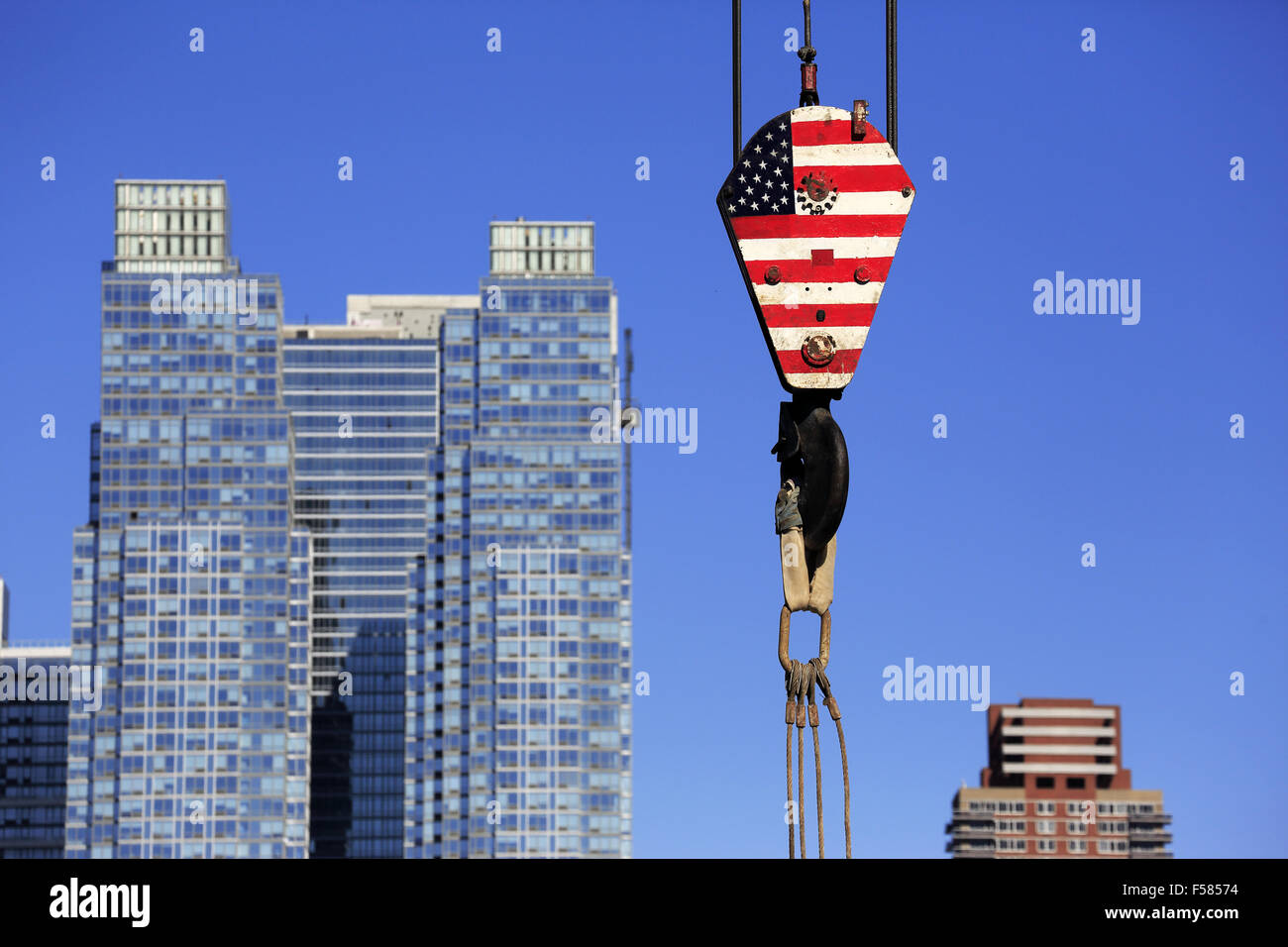 American flag painted on main hook block of a construction crane on ...