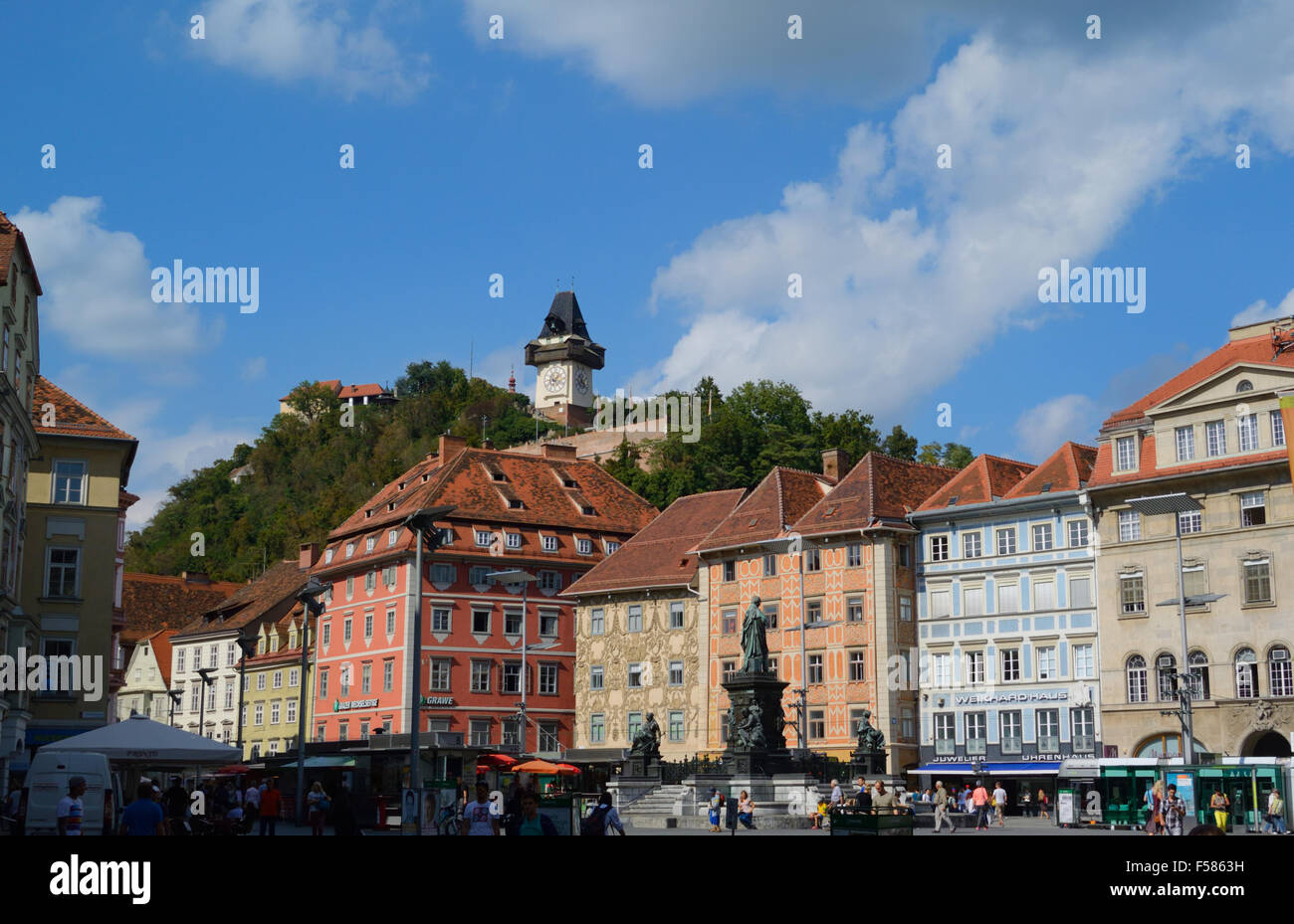 The beautiful historic main square with the castle hill (Schlossberg ...