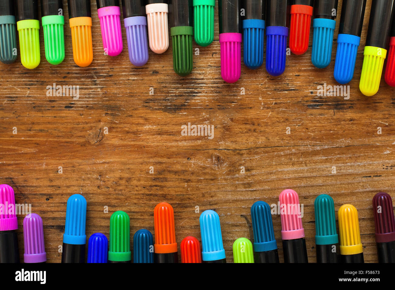 colorful markers on wooden desk, background Stock Photo - Alamy