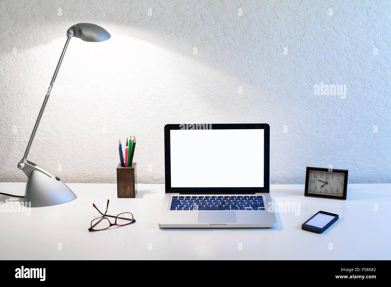 office workplace of business person, table with laptop and lamp Stock ...