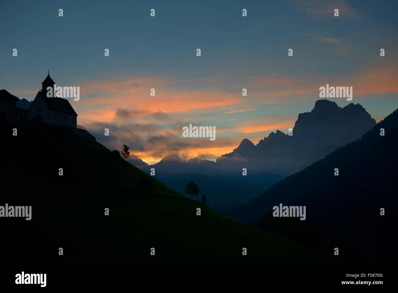 Sunrise at the church of Colle Santa Lucia in the Dolomites, Italy ...