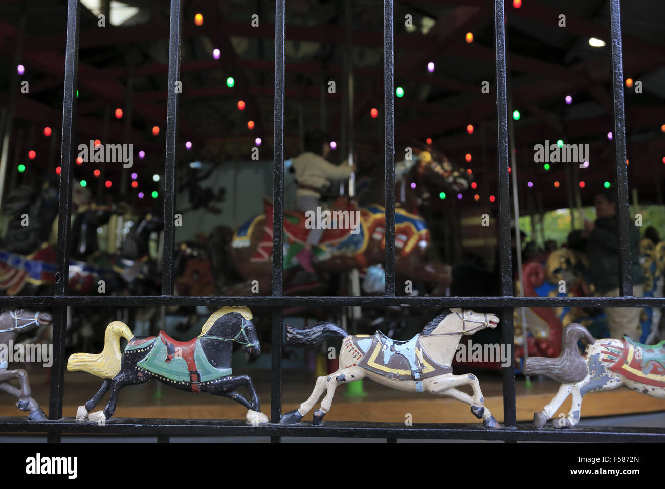 running horse sculptures decorating the fence of Central Park Carousel ...