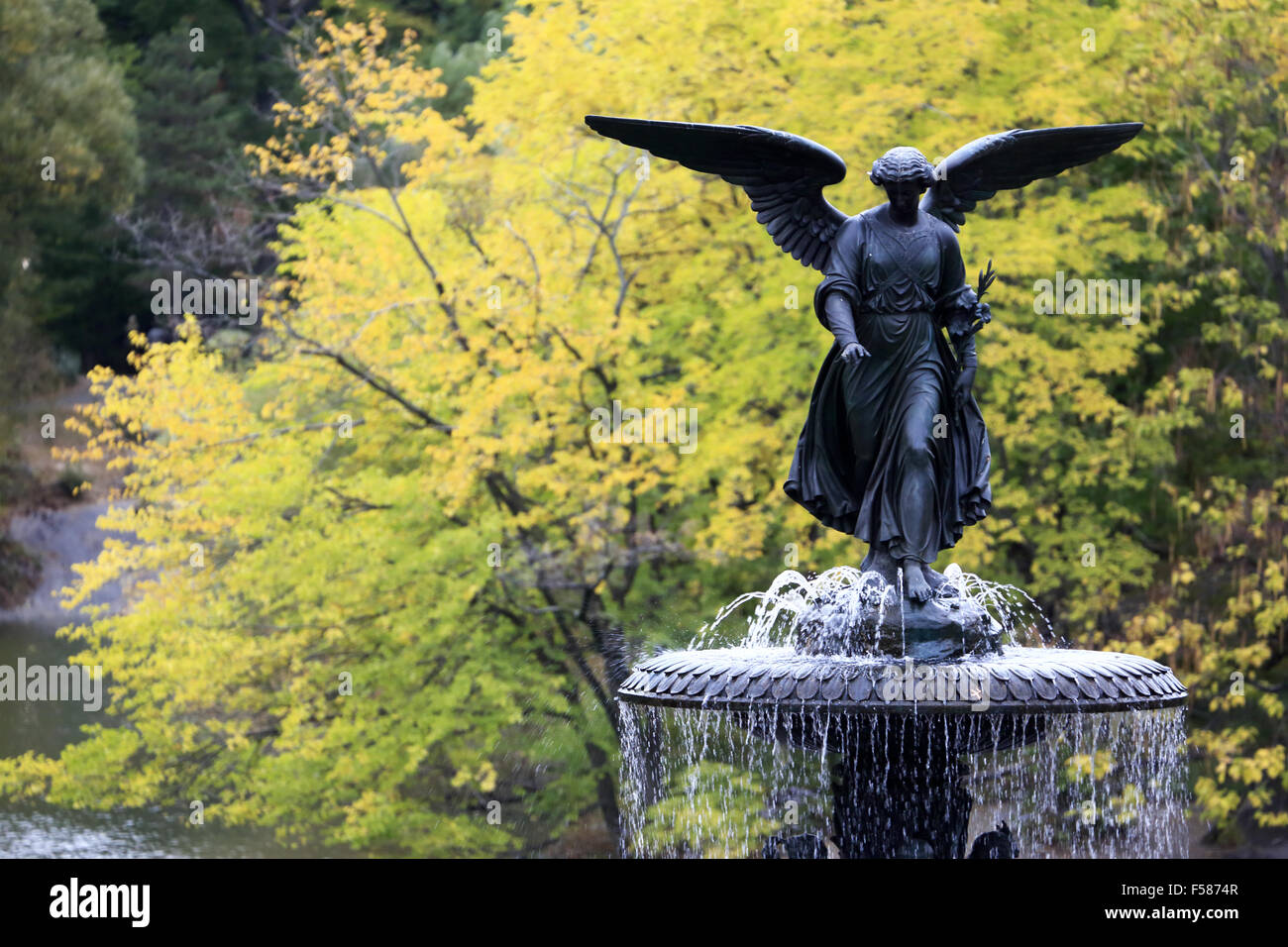 A closed up view of winged angel of Bethesda Fountain with the Lake and ...