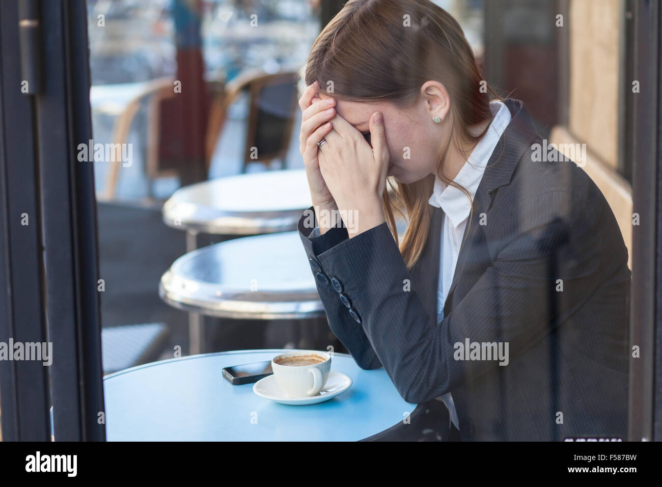 woman crying in cafe Stock Photo - Alamy