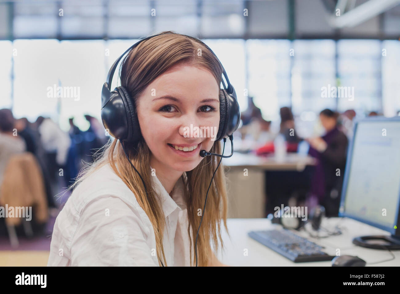 happy student with headphones and computer in university Stock Photo ...