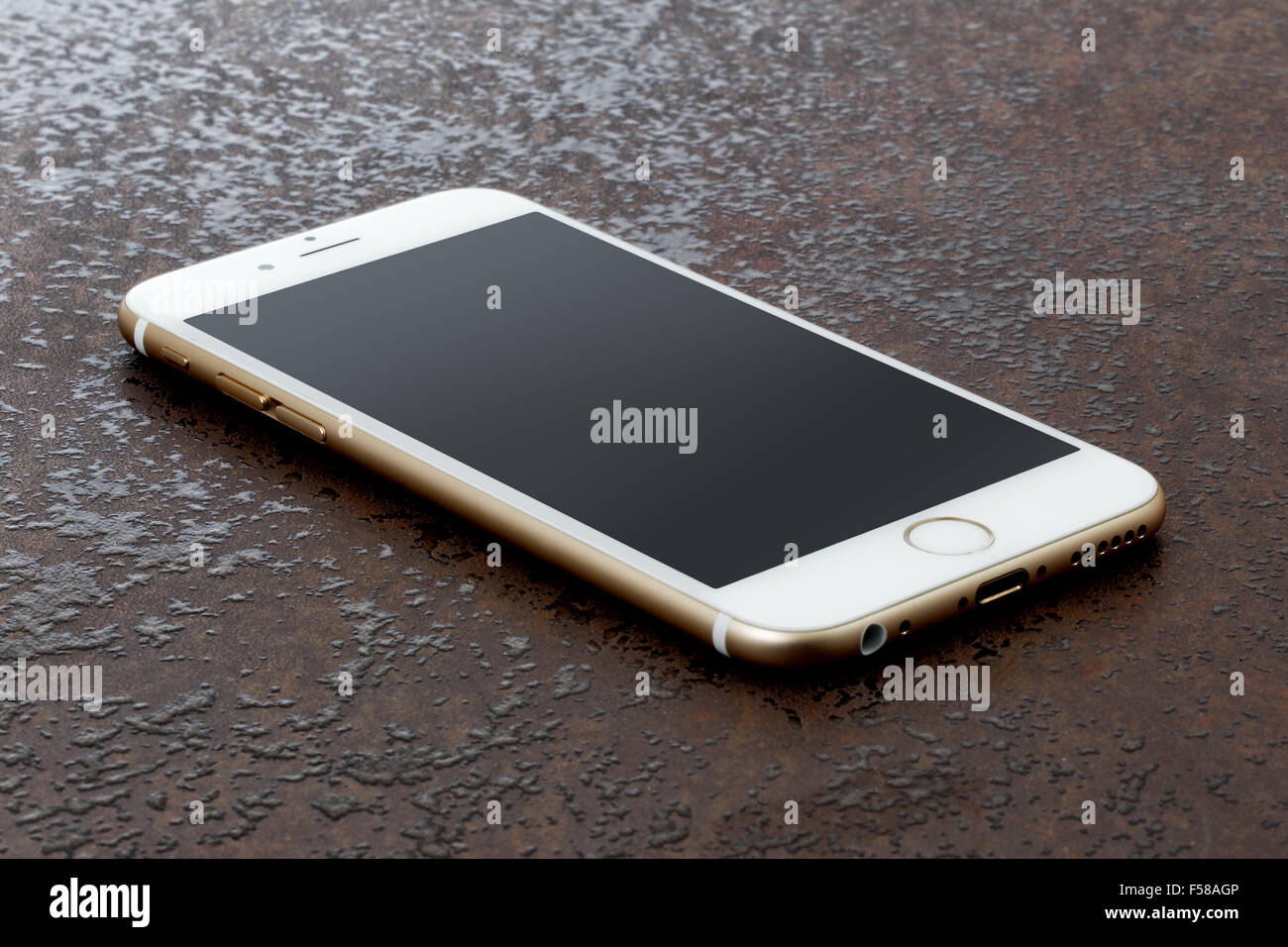 Golden iPhone 6 on stone table Stock Photo - Alamy