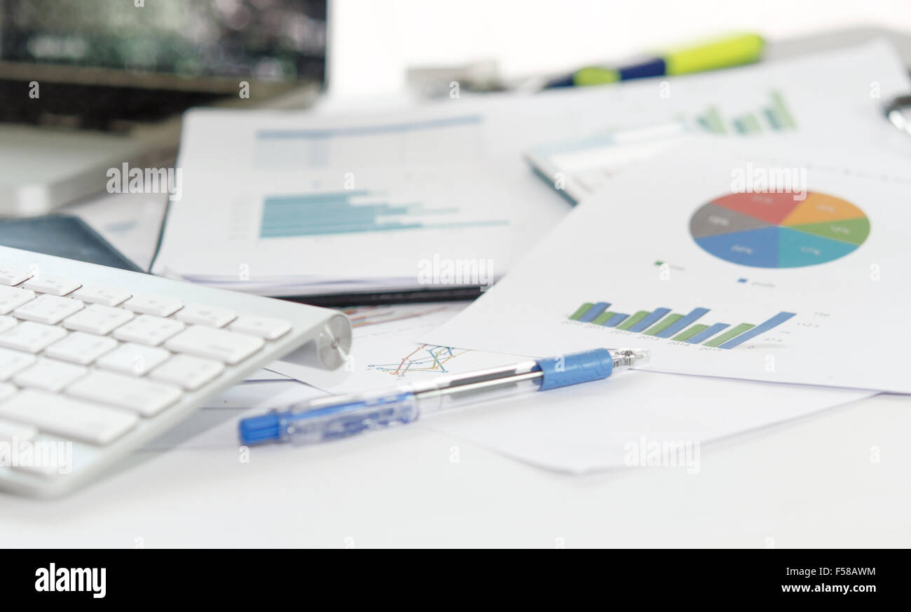 Documents, graphs on a desk Stock Photo - Alamy