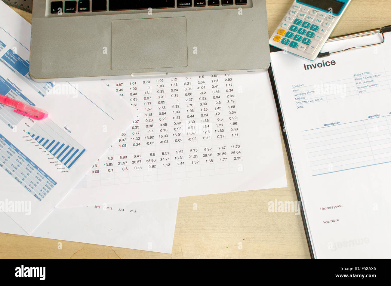 Financial documents and computers calculator Stock Photo - Alamy