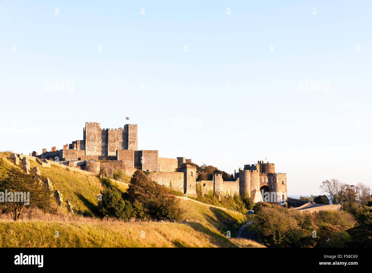 England, Dover castle. Castle on horizon showing walls and keep lit up ...