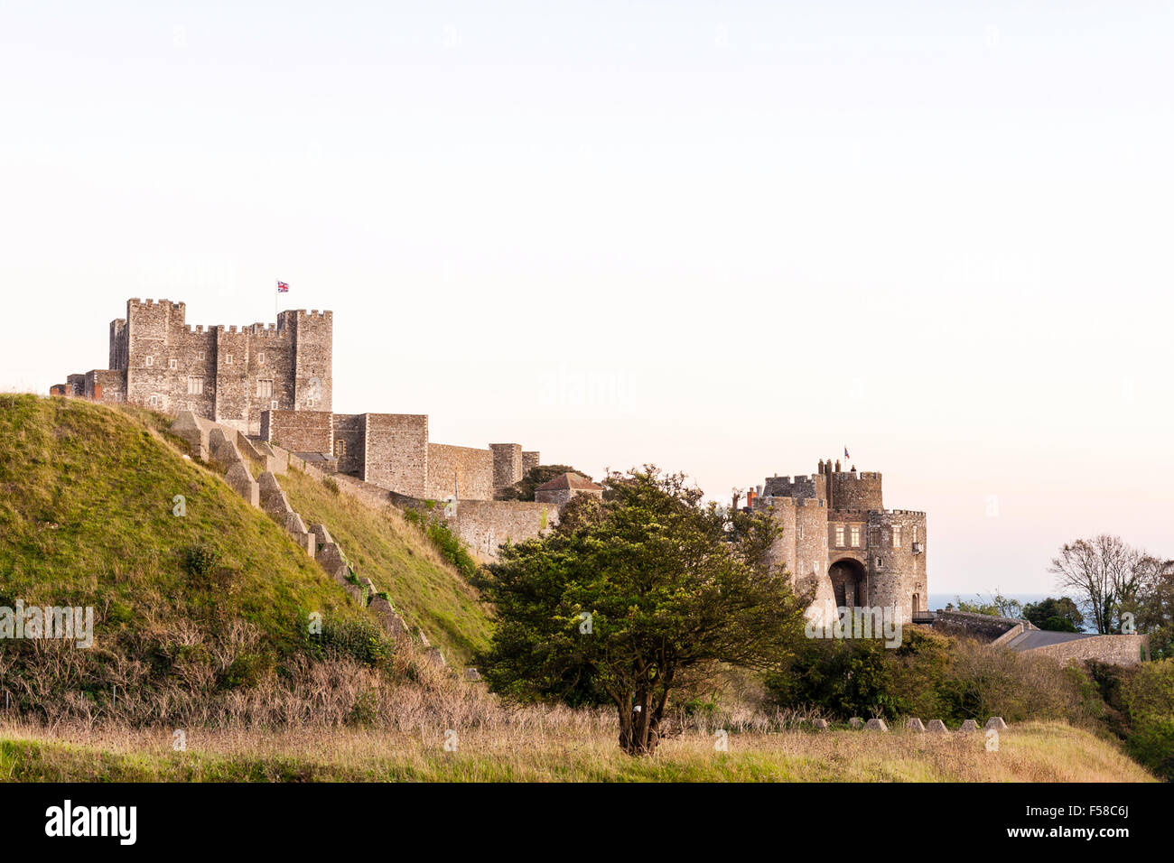 England, Dover castle. Castle on horizon showing walls and keep. Dusk ...