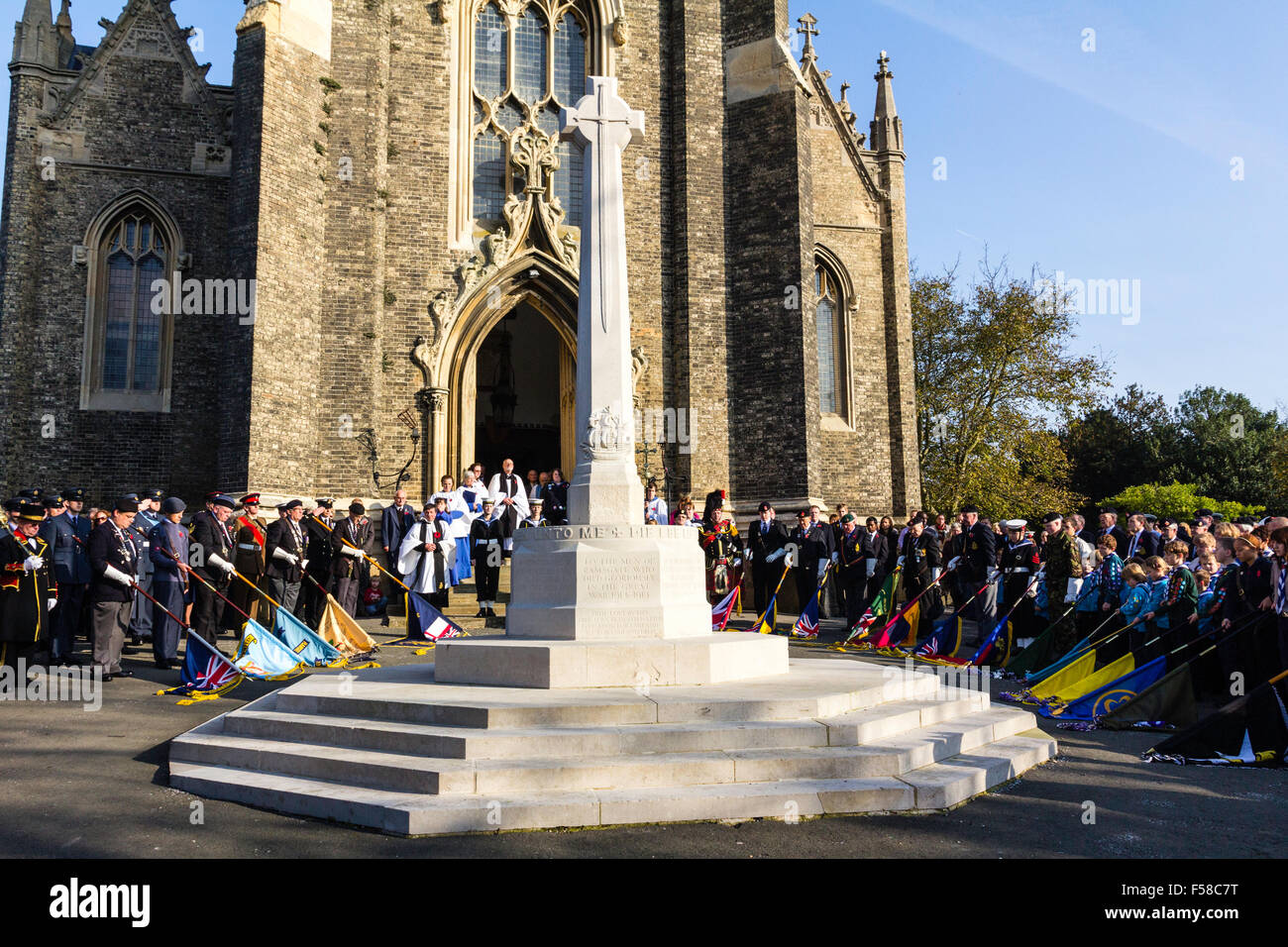 England, Ramsgate. Remembrance Sunday. Cenotaph and church, soldiers ...