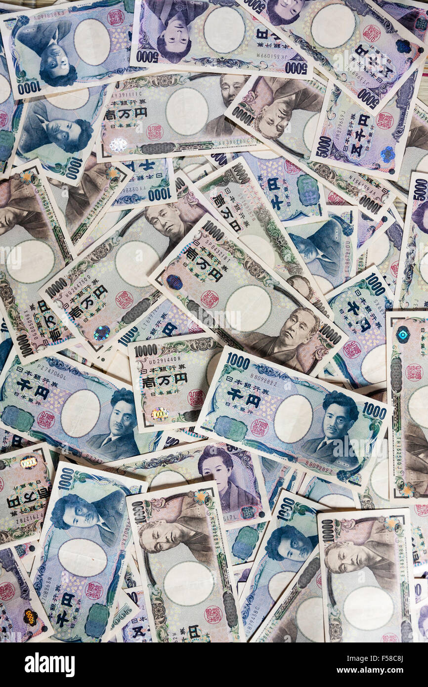 Japan. Overhead view of Japanese banknotes, various values, scattered ...