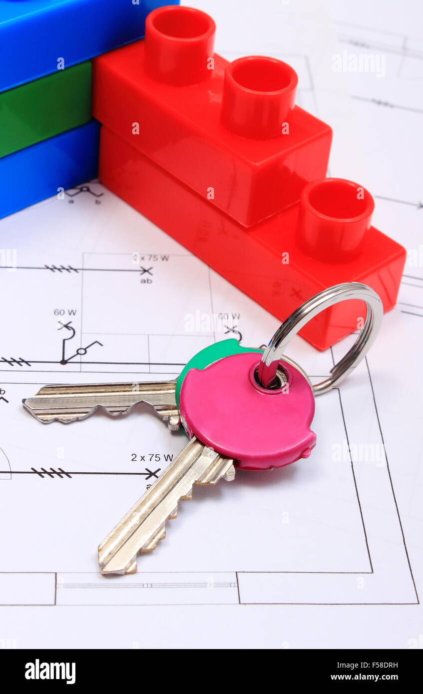 Home keys and wall of plastic colorful building blocks lying on ...
