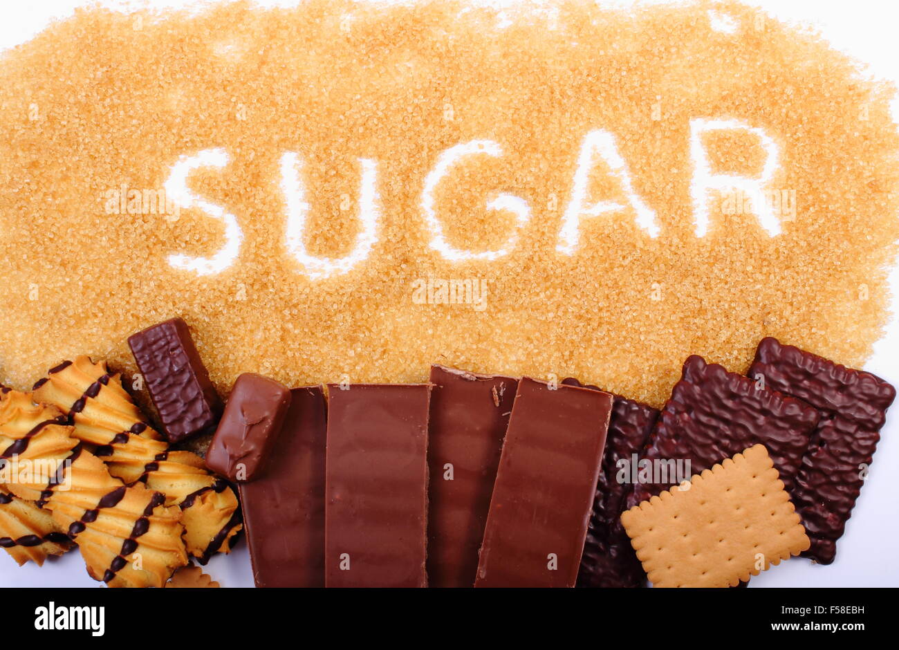 Word sugar written in granulated natural brown cane sugar and a lot of ...