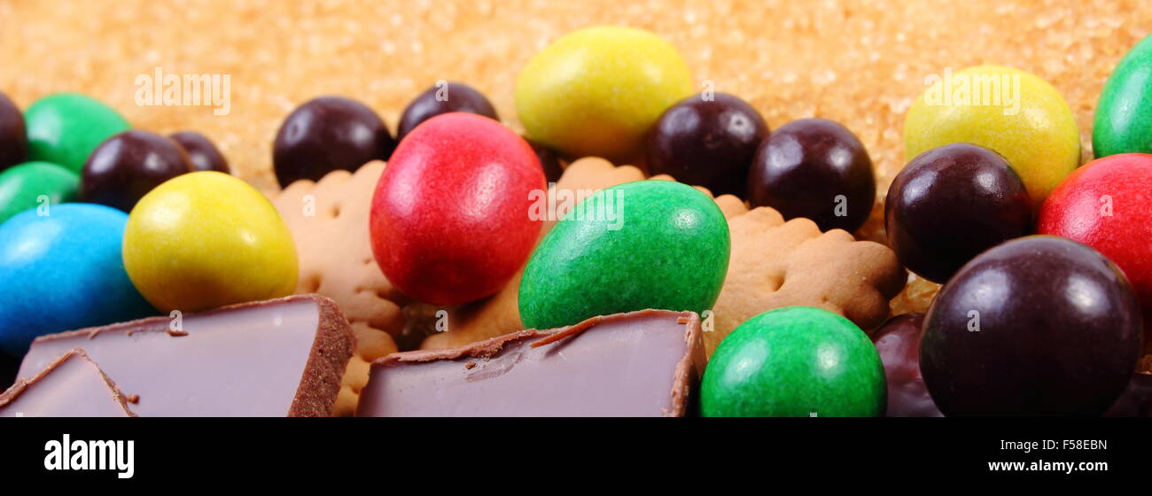 A lot of candies and cookies with brown cane sugar, too many sweets ...