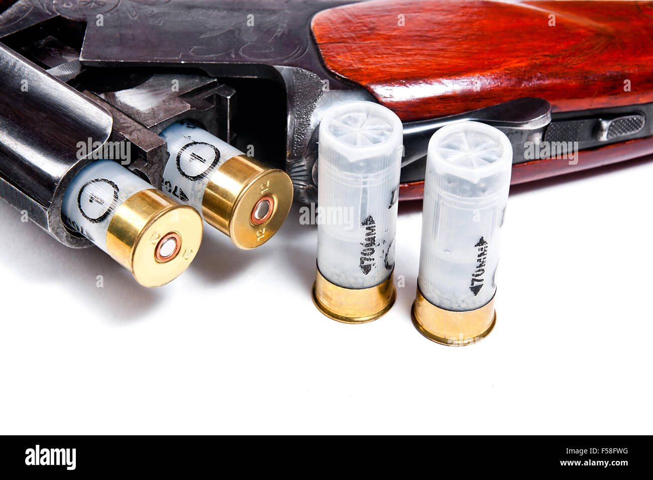 Hunting shotgun and ammunition on white background. Cartridges for ...