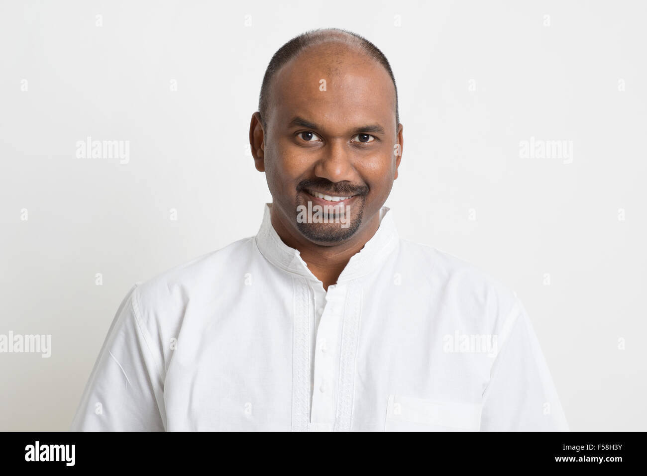 Indian man smiling standing hi-res stock photography and images - Alamy