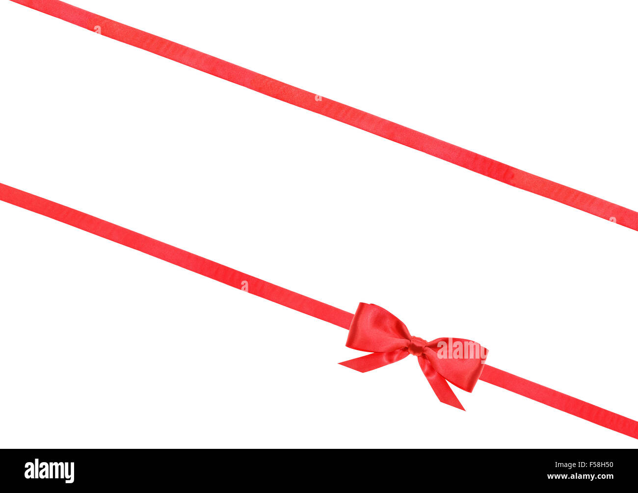 little red satin bow and two diagonal ribbons isolated on horizontal ...
