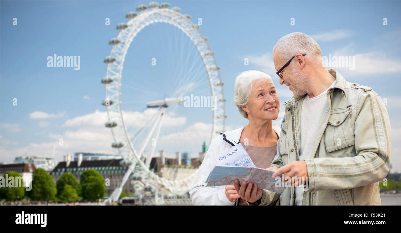senior couple with map talking over london Stock Photo - Alamy