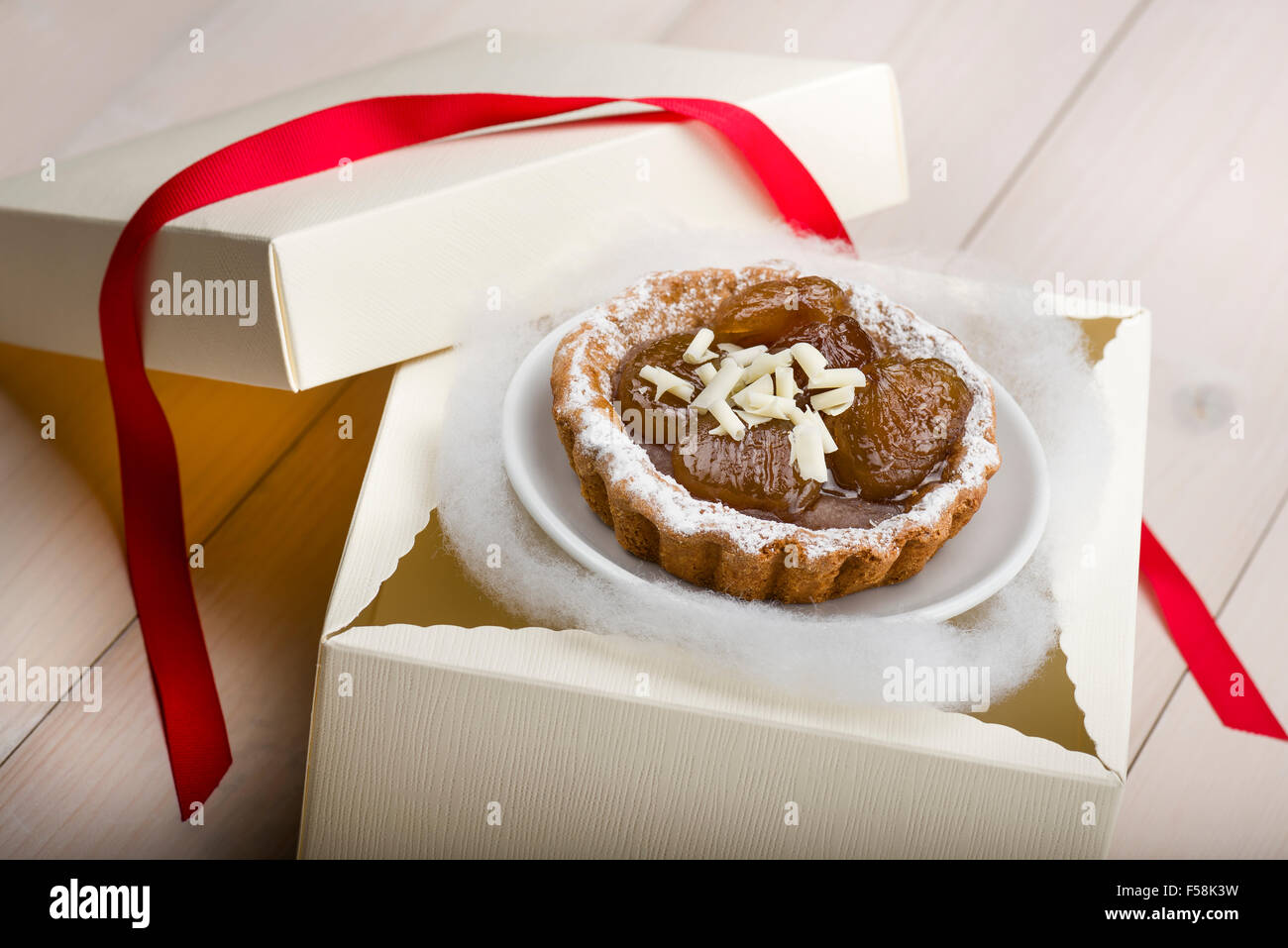 chestnut cake decorated with white chocolate on gift box Stock Photo ...