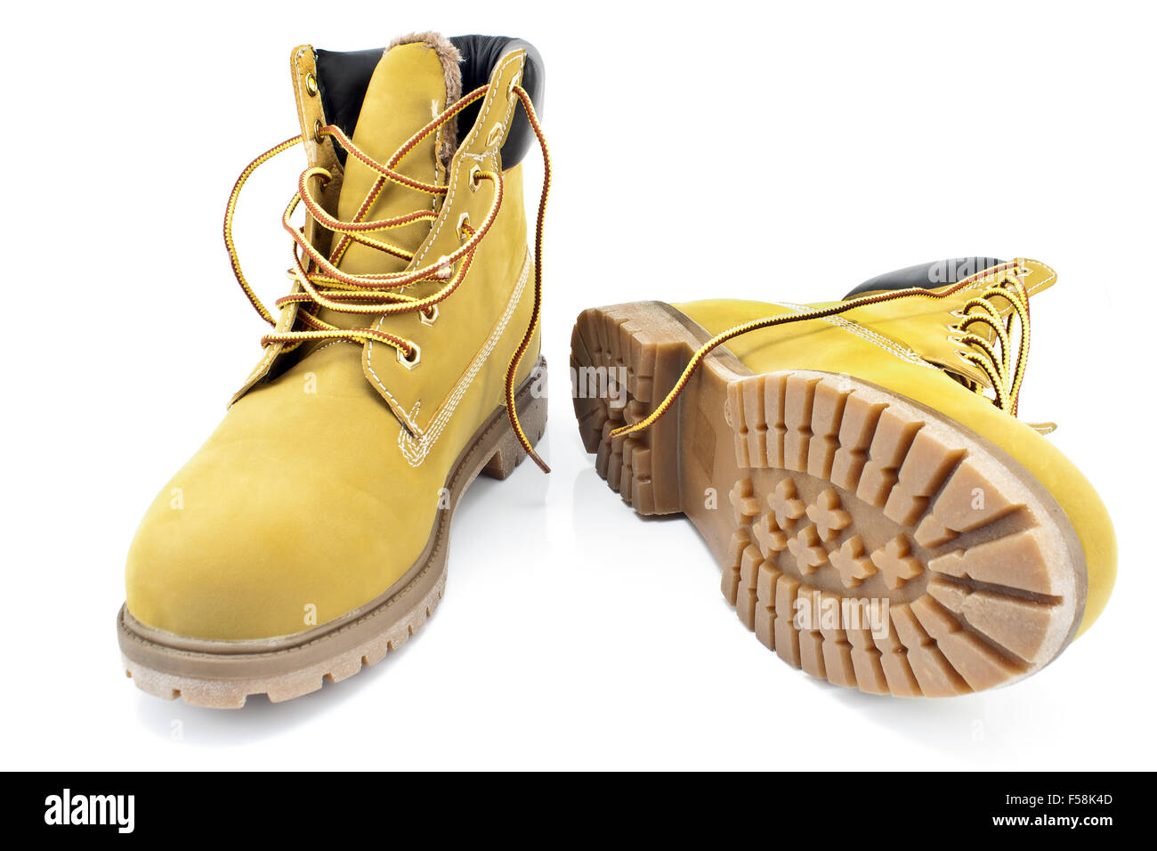 New yellow boots isolated on white Stock Photo - Alamy