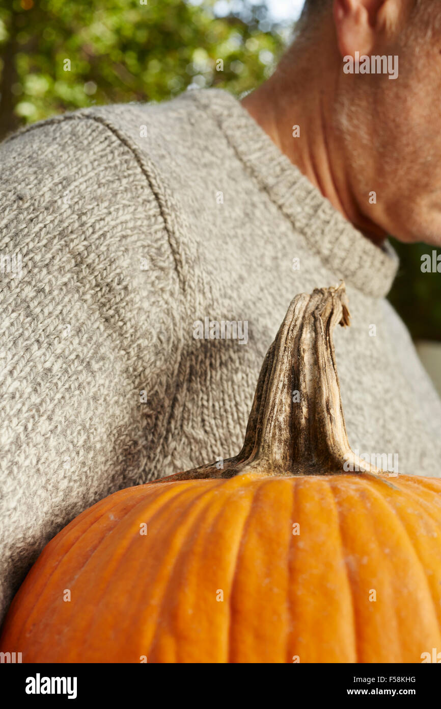 Man carrying a pumpkin Stock Photo - Alamy