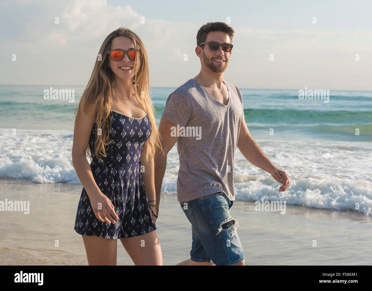 Happy couple at the beach Stock Photo - Alamy