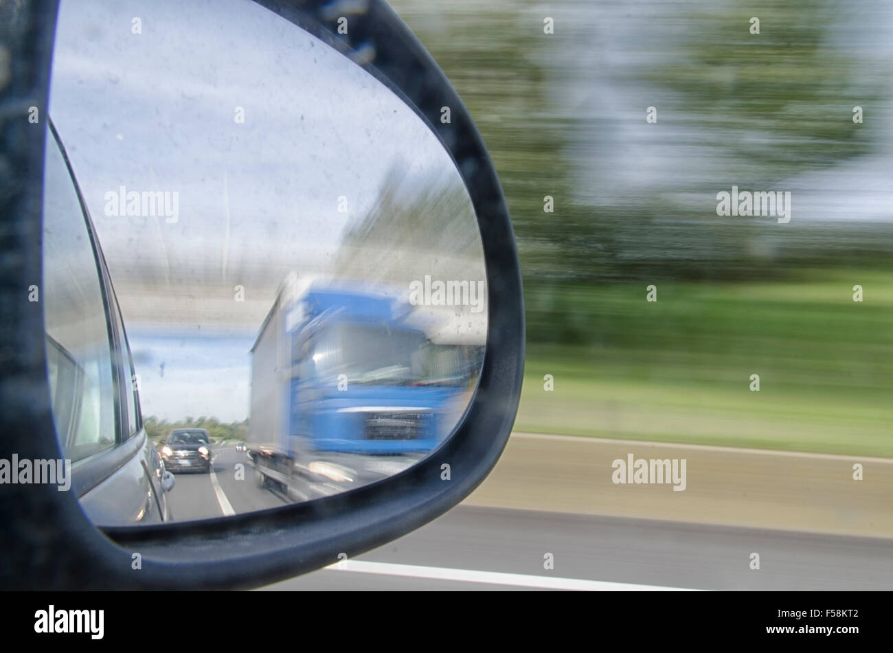 Overtaking a truck seen in the rearview mirror Stock Photo - Alamy