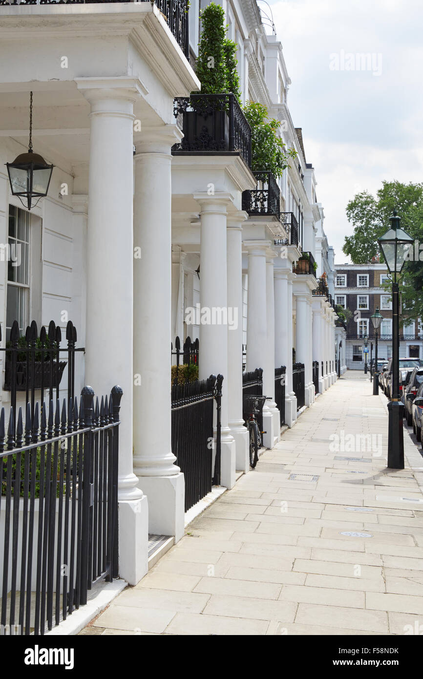 Row of beautiful white Edwardian houses in Kensington, London Stock ...