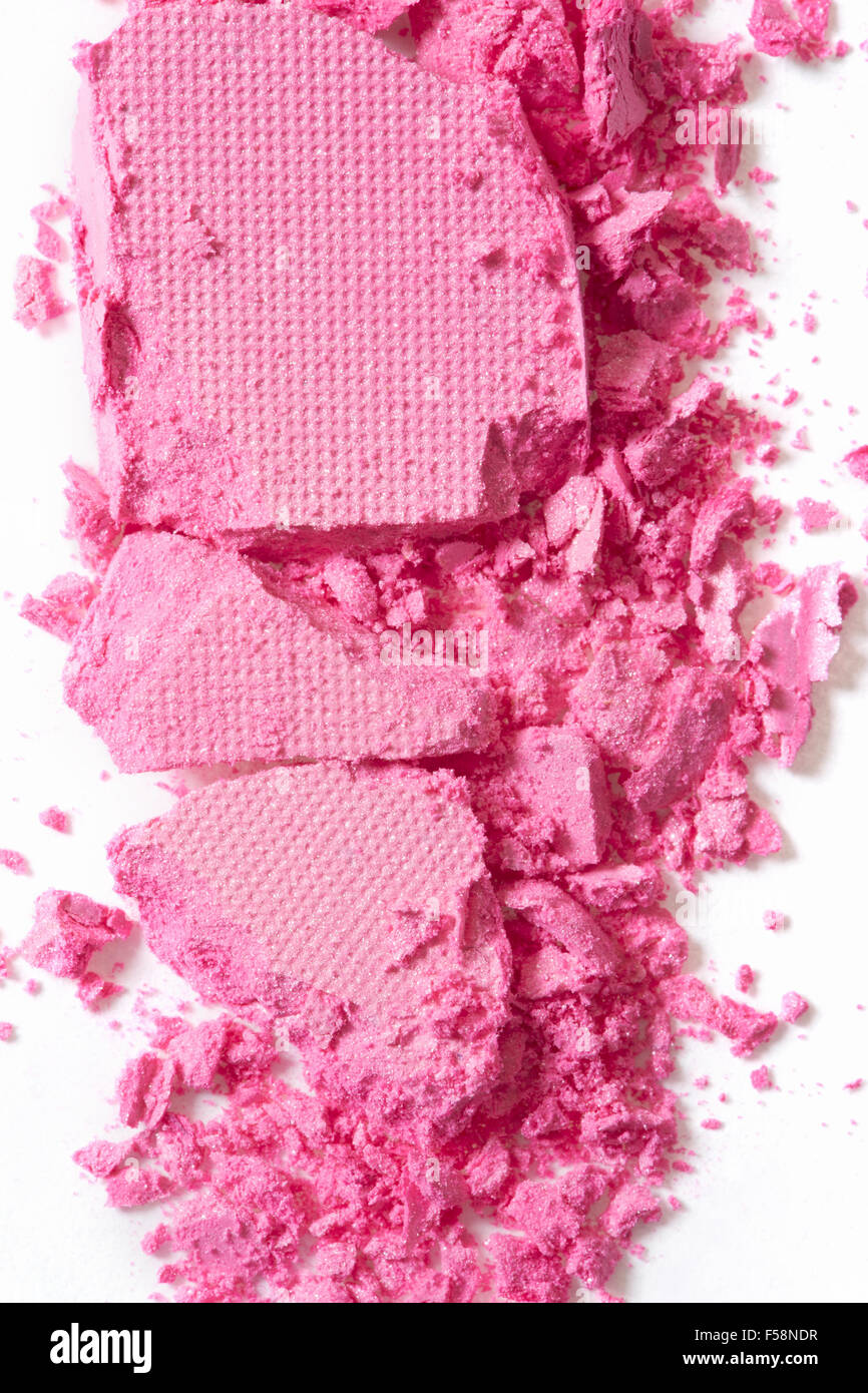 Pink eye shadow crushed on white background Stock Photo - Alamy