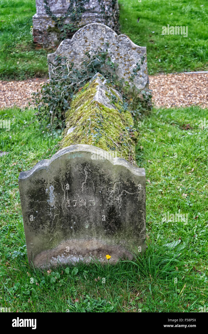 Ancient grave headstones in an English village churchyard, Suffolk, UK ...