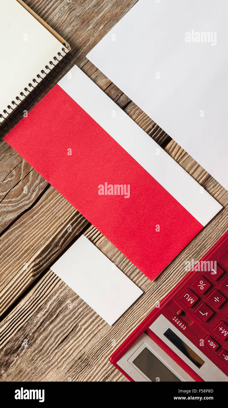 The mockup on wooden background with red calculator Stock Photo - Alamy