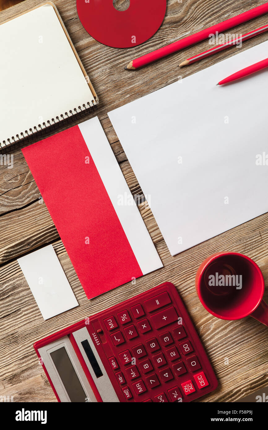 The mockup on wooden background with red calculator Stock Photo - Alamy