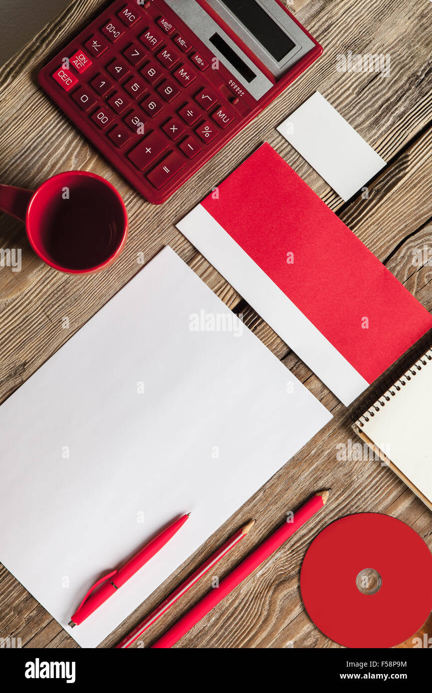 The mockup on wooden background with red calculator Stock Photo - Alamy