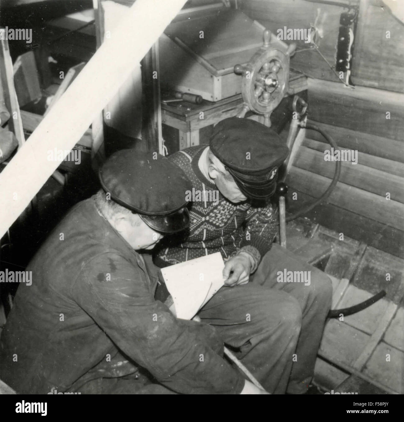 Two men adjust the engine of the boat, Denmark Stock Photo - Alamy