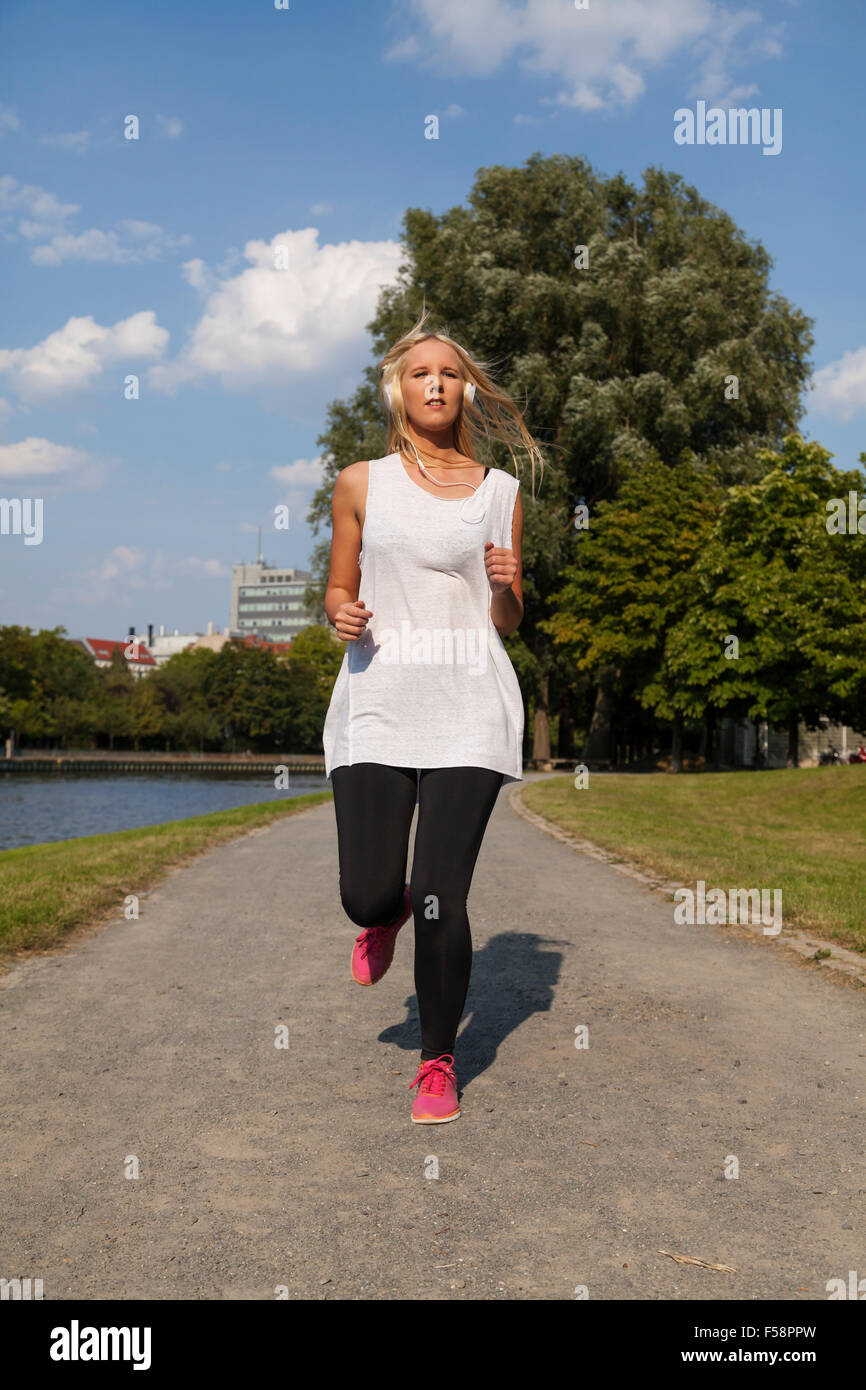 Woman jogging hi-res stock photography and images - Alamy