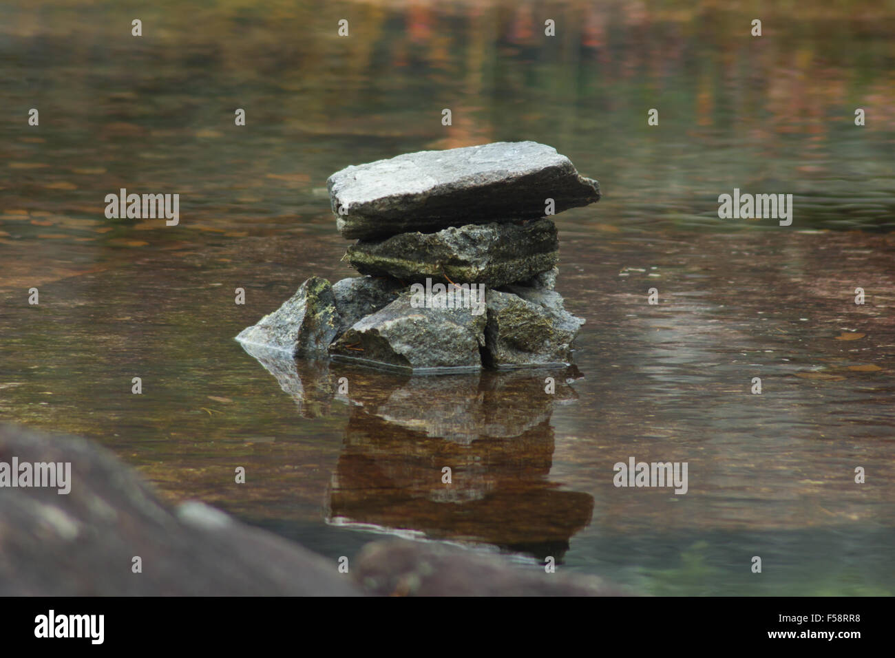 Stack of stones in the water Stock Photo - Alamy