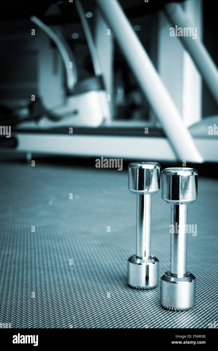 Dumbbell gym metal weights in exercise room in sports bodybuilder gym ...