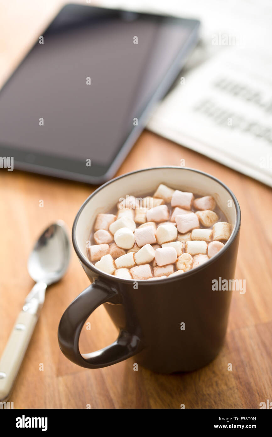 Cocoa drink with marshmallows in mug on table Stock Photo - Alamy