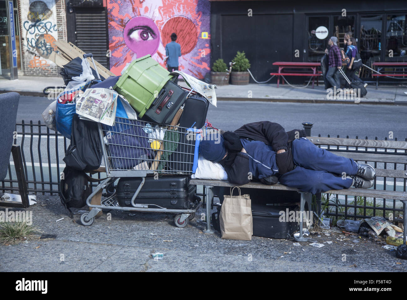 Homeless man sleeps next to his belongings on the Lower East Side, New ...
