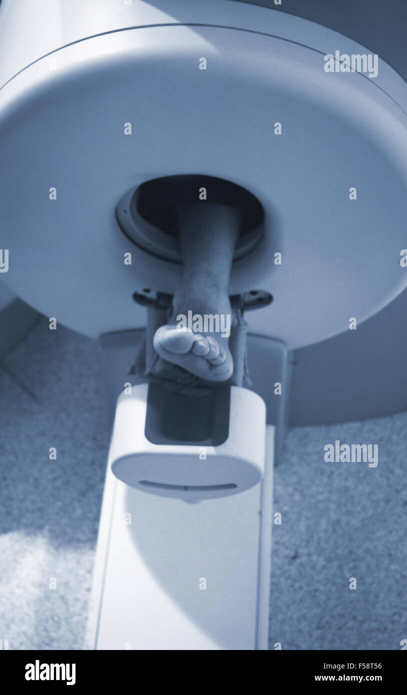 Patient in fully open high field Magnetic Resonance Image MRI scanner ...