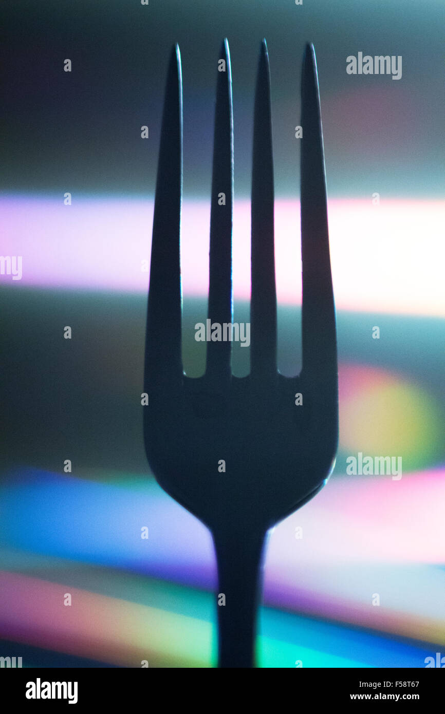Fork dining symbol silhouette on colorful background photo Stock Photo ...