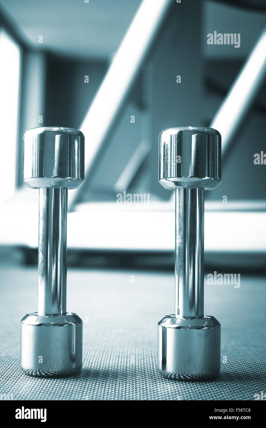 Dumbbell gym metal weights in exercise room in sports bodybuilder gym ...
