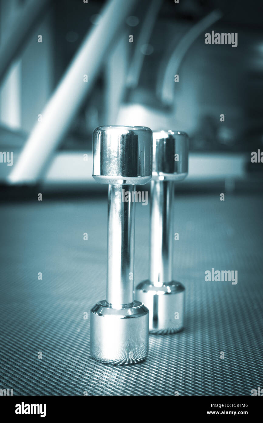 Dumbbell gym metal weights in exercise room in sports bodybuilder gym ...