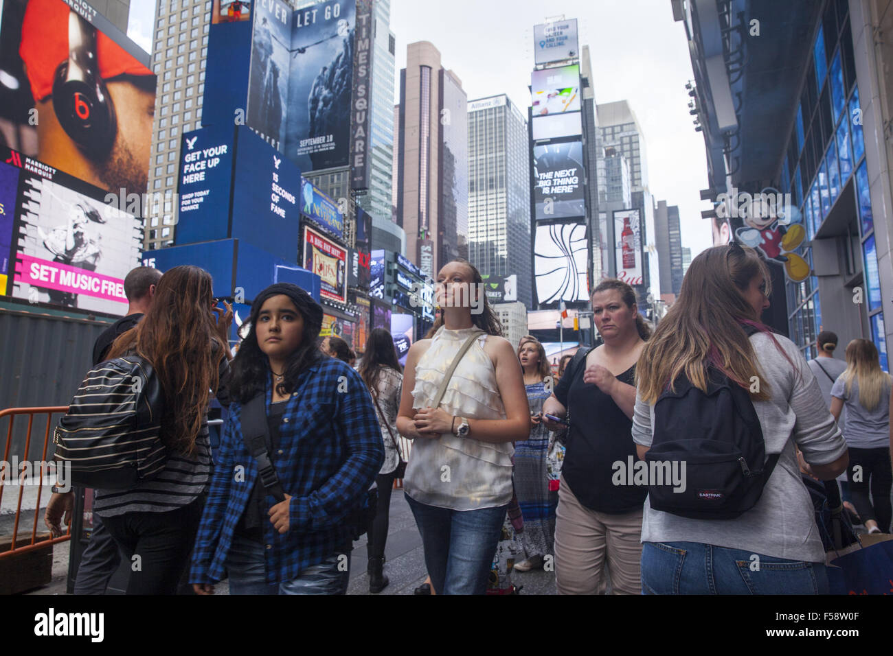 Young people cruising the sights on the sidewalk in Times Square, New ...