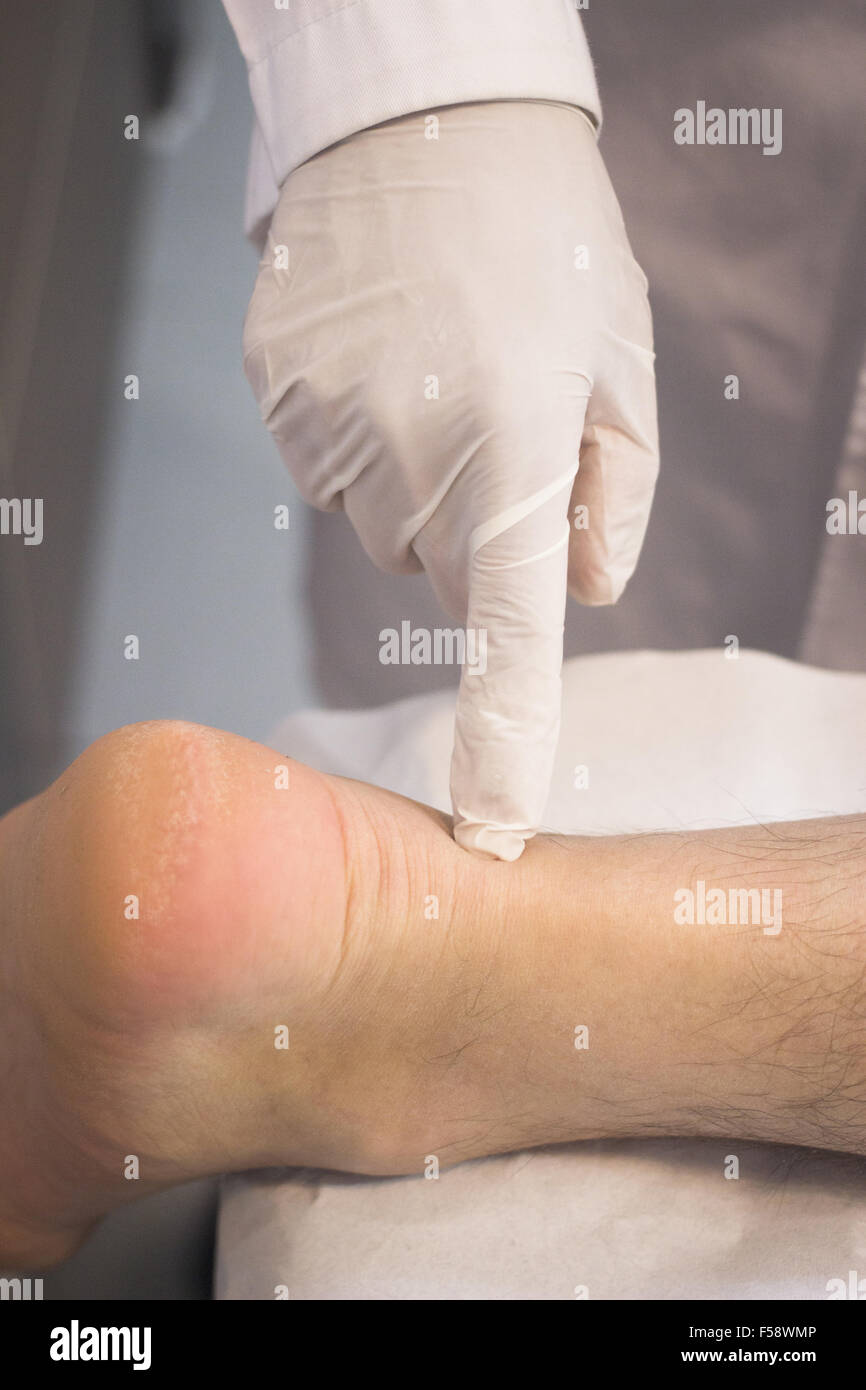 Male Traumatologist orthopedics surgeon doctor examining middle aged ...