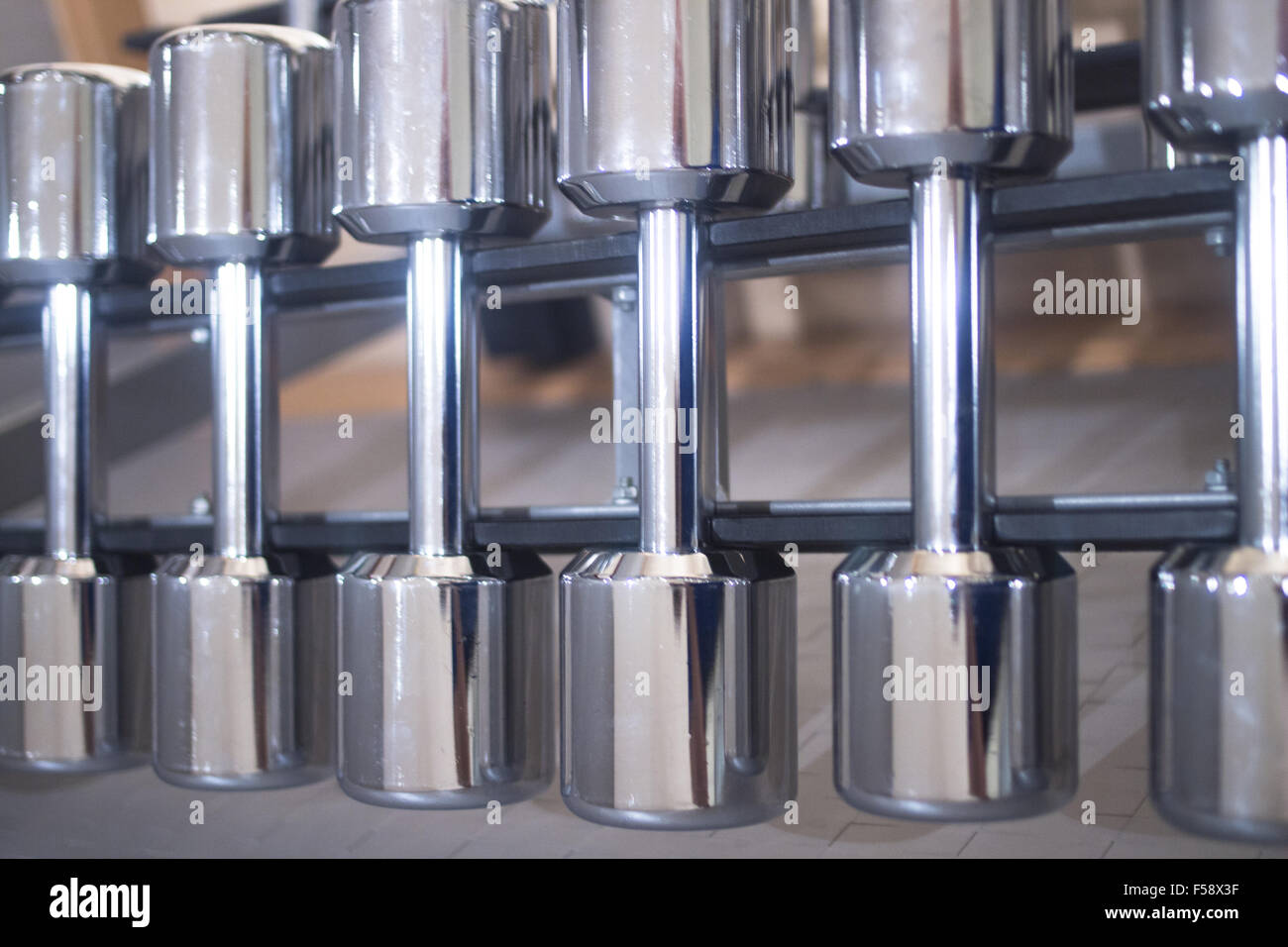 Dumbbells gym metal weights in exercise room in gym health club fitness ...